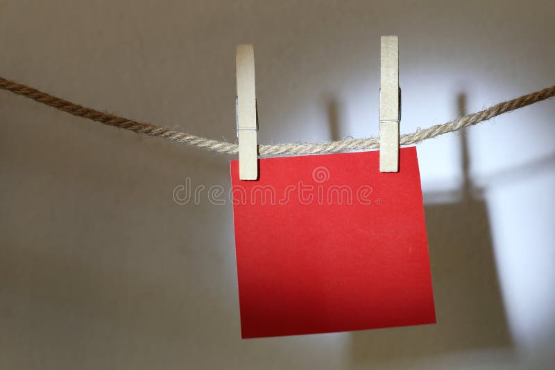 Red Note Paper Hanging on Rope on White Wall Stock Photo - Image of ...