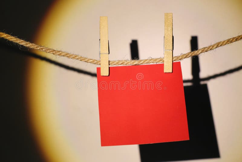 Red Note Paper Hanging on Rope on White Wall Stock Photo - Image of ...