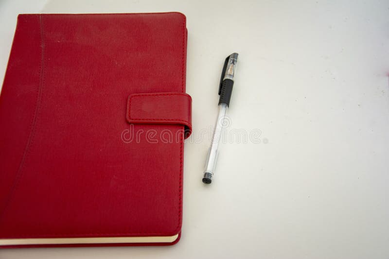 Red Notebook and Neutral Pen on White Background Stock Image - Image of ...