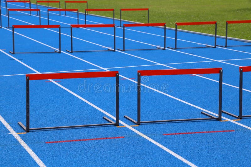 Red Obstacles on the Blue Running Track during a Race Stock Image ...