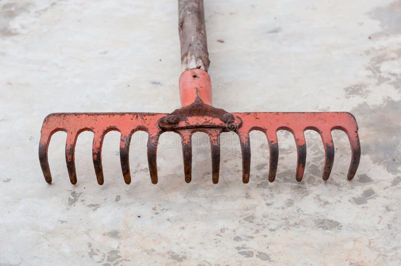 The Red Old Rake on the Cement Floor Ground Stock Photo - Image of ...