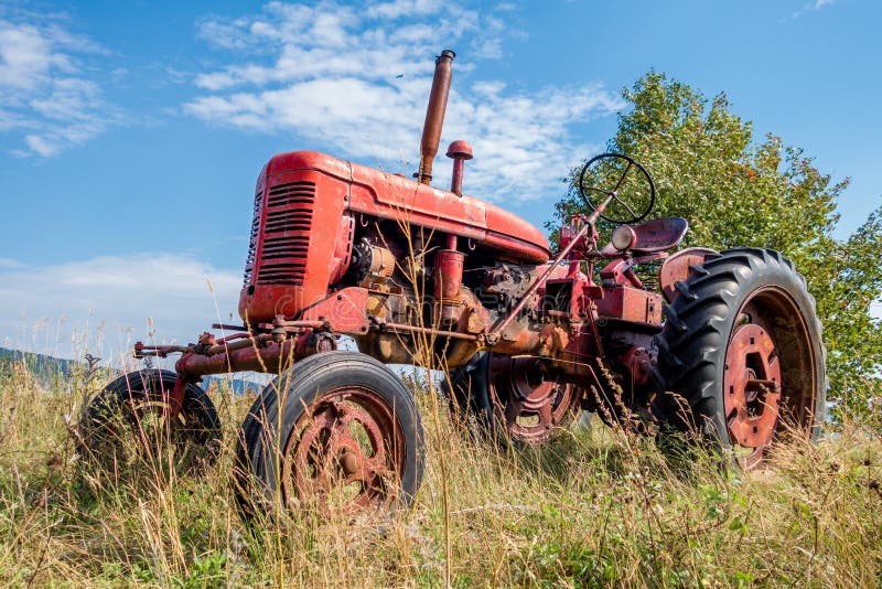 Red old rusty tractor stock image. Image of tractors - 71911987