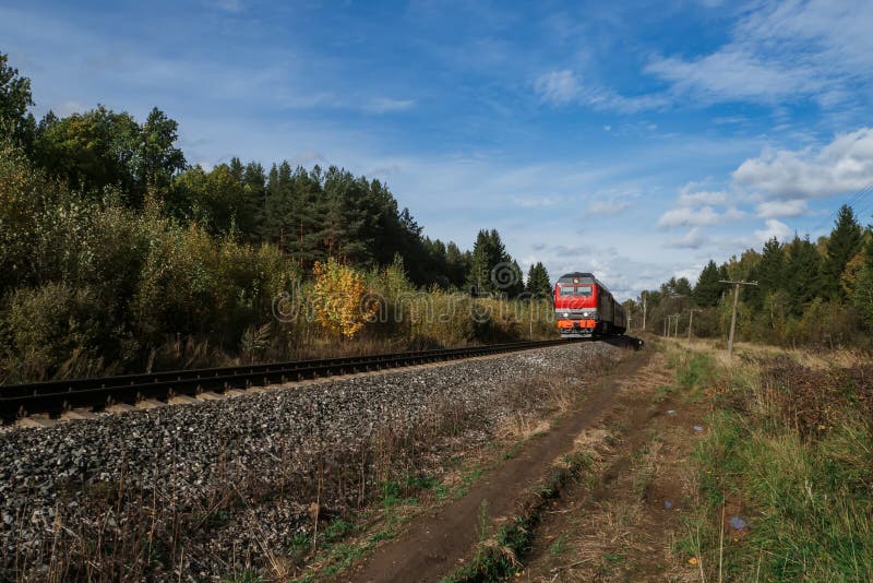 Red Old Train Rides by Rail among the Forest in Summer Stock Image ...