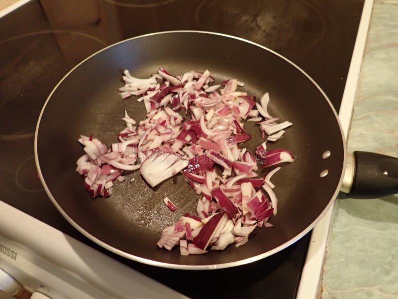 Red Onion Pieces on a Frying Pan Stock Photo - Image of cure, rosemary ...