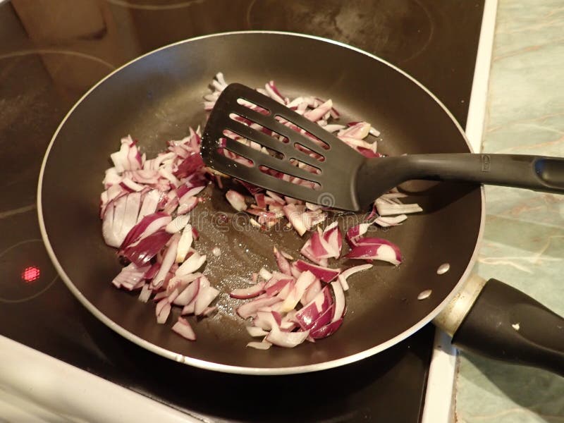 Red Onion Pieces on a Frying Pan Stock Photo - Image of salty, carrots ...