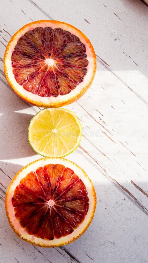 Red Orange Cut in Half, Half Lime Close-up, Copy Space, Pattern, Rough ...