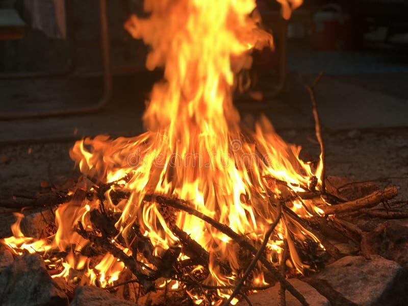Red-orange Fire Lit on Rocks Stock Image - Image of stickmade, sticks ...