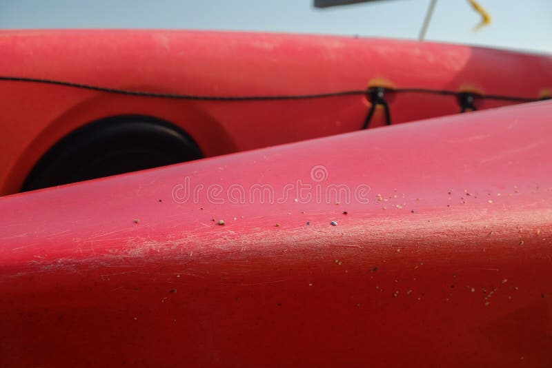 Red and Orange Kayak in Storage Stock Photo - Image of metal, wire ...