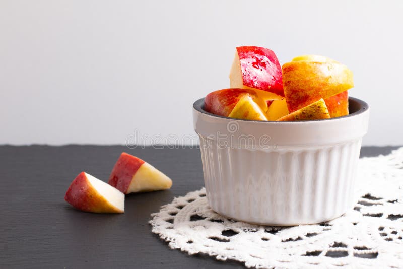 Red Organic Apple Chopped Dice in White Cup on Black Slate Board Stock ...