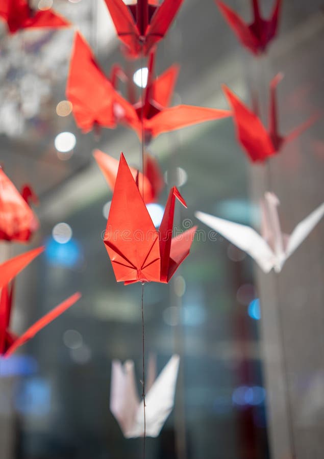 Red Origami Birds Fly with Strings for Display Design. Stock Image ...
