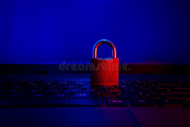 Red Padlock on Laptop Keyboard Under Blue and Red Lighting Stock Photo ...