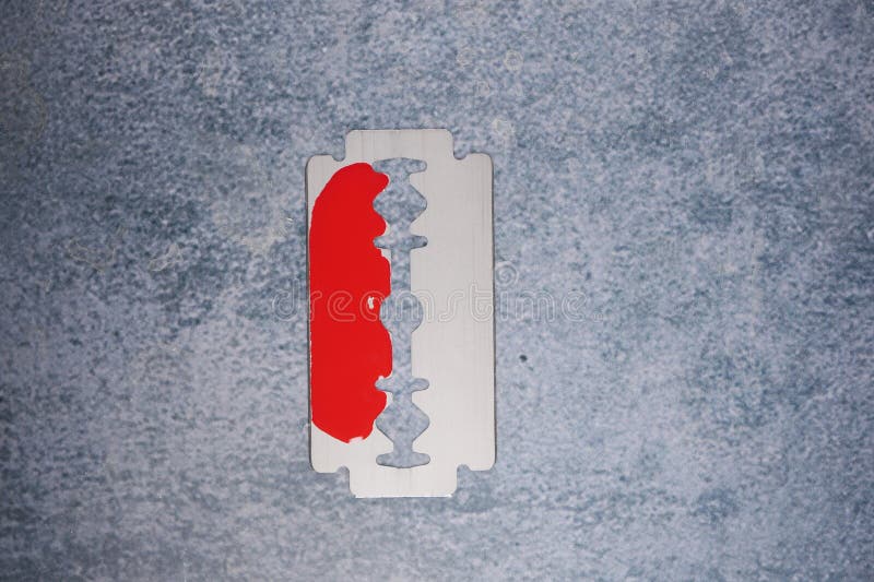 Red Paint on Metal Razor Blade on Gray Surface Stock Image - Image of ...