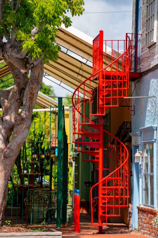 Red Painted Spiral Ladder at an Old House Stock Image - Image of bright ...