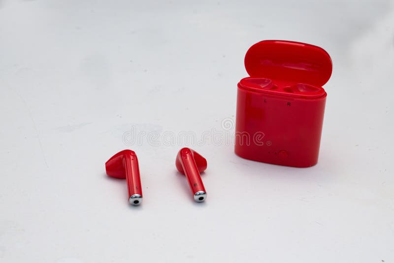A Red Pair of Wireless Earbuds and Case Stock Photo - Image of isolated ...
