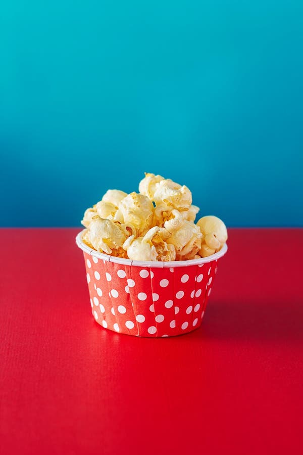 Red Paper Cup with Popcorn Against Vibrant Background. Stock Image ...
