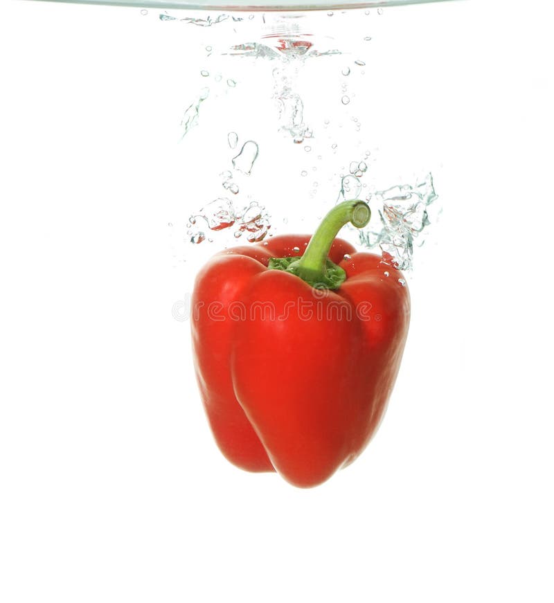Red paprika in clear water stock photo. Image of plant - 27405866