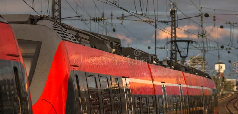 Red Passenger Train in the Evening Stock Image - Image of track, lights ...