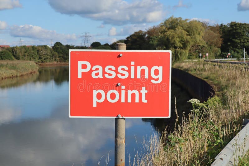 A Red Passing Point Sign by the Side of the River Exe Near Exeter in ...