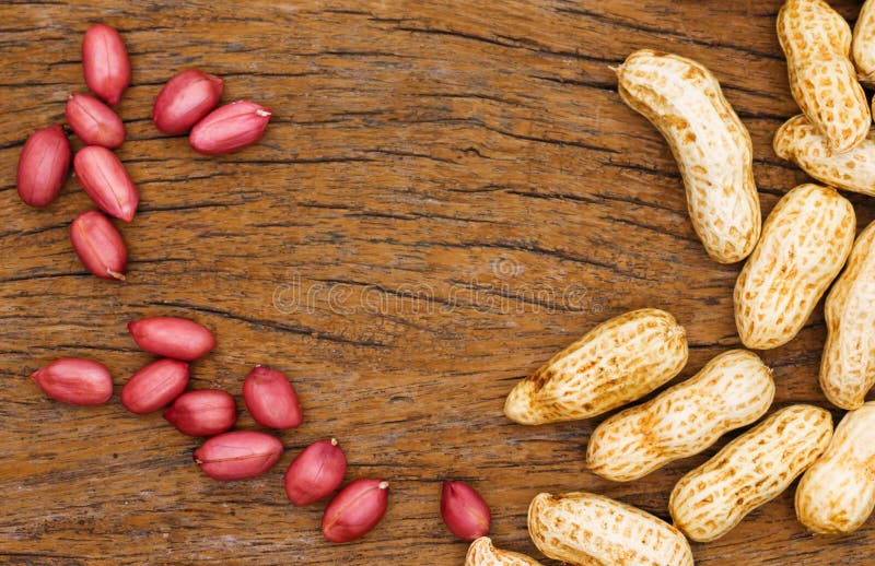 Red peanuts on wood stock image. Image of ingredient - 94775481