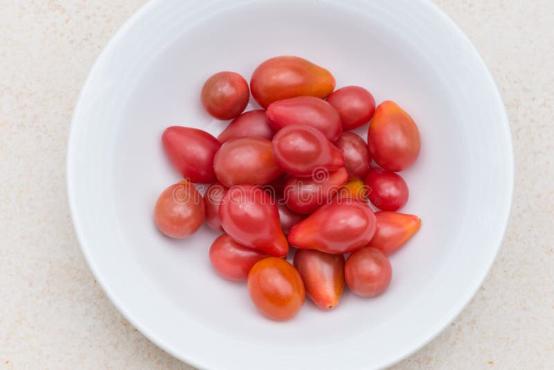 Red Pear Cherry Tomatoes in a Bowl Stock Image - Image of color, beige ...