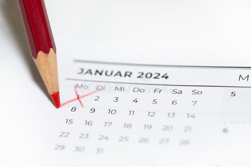 A Red Pen Marks the First of January on a 2024 Calendar. the Background ...