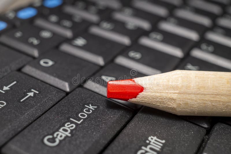 Red Pencil on a Computer Keyboard in Close Up Stock Image - Image of ...