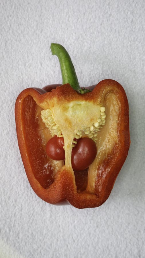 Red Pepper Cut in Half with Small Paprika Inside,white Background. Copy ...