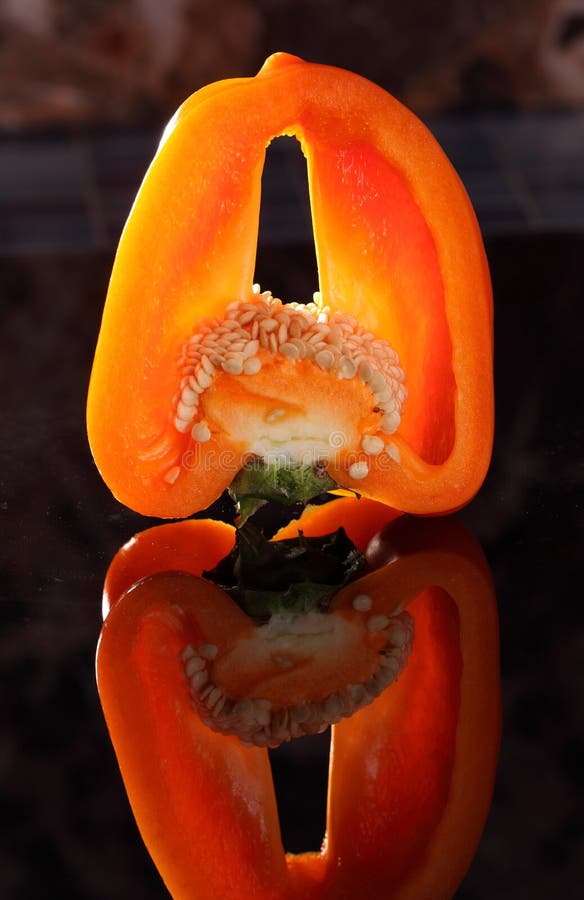 Red pepper half on black stock photo. Image of freshly - 10166200