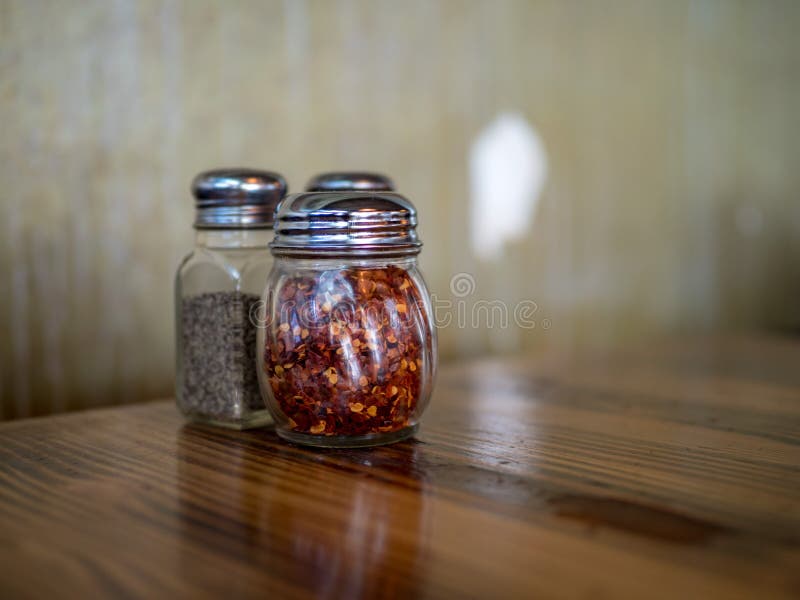 Red Pepper and Salt Condiments on Table Stock Photo - Image of salt ...