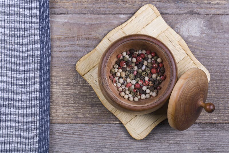 Red Pepper with Spices in a Wooden Bowl on a Wooden Table Stock Photo ...