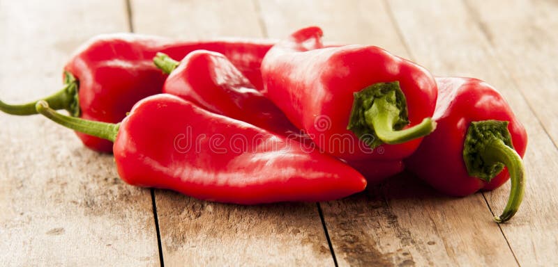 Red pepper on wooden table stock image. Image of organic - 77643135