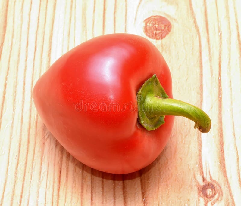 Red pepper on wooden table stock photo. Image of bell - 54951928