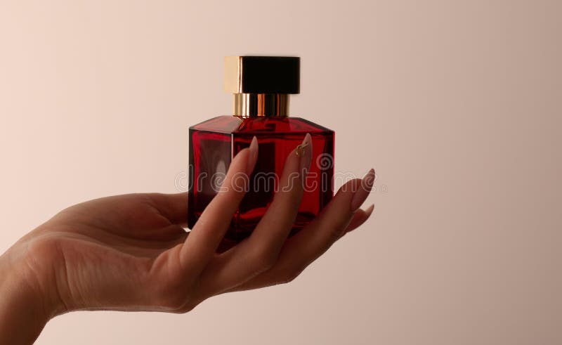 Perfume in a Beautiful Female Hand Stock Photo - Image of hands, bottle ...