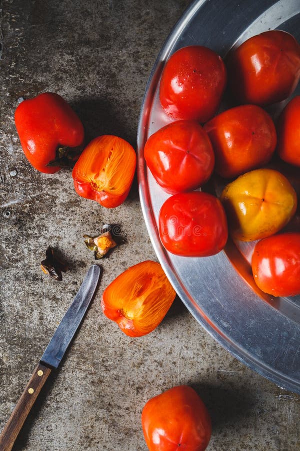 Red Persimmons stock photo. Image of sunlight, tasty - 83289568