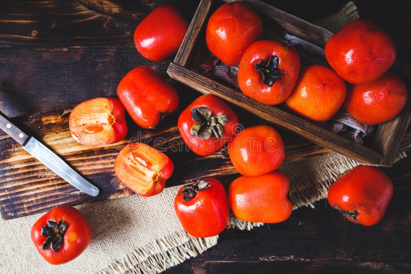 Red Persimmons stock photo. Image of sunlight, plant - 83274410