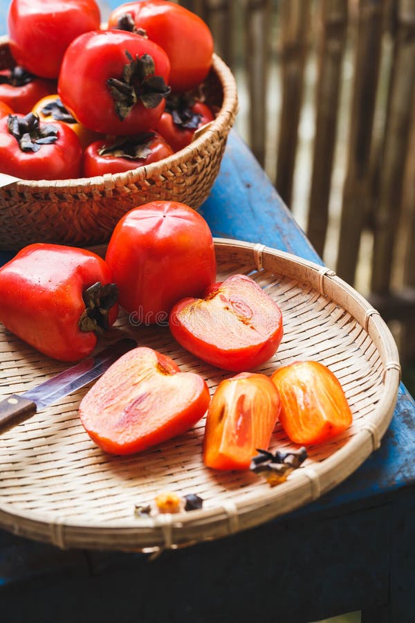 Red Persimmons stock image. Image of burlap, plant, ripe - 83291789