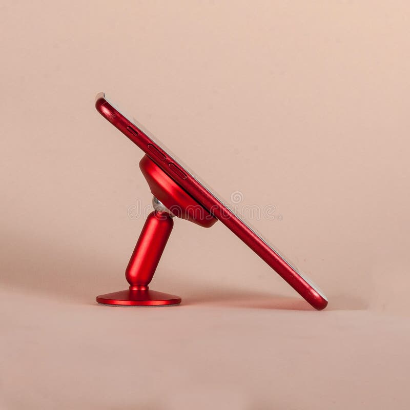 Red Phone on Megnetic Car Phone Holder Over Pink Background Stock Image ...