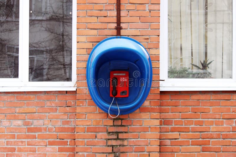Red Phone Public Apparatus Protected Blue Booth on the Brick Wall of ...