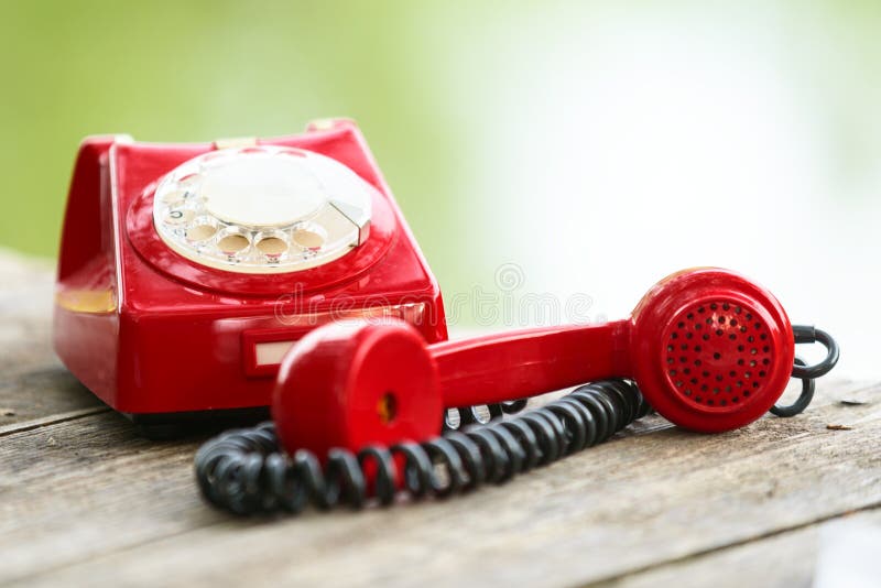 Red phone on wooden deck stock photo. Image of empty - 54471780