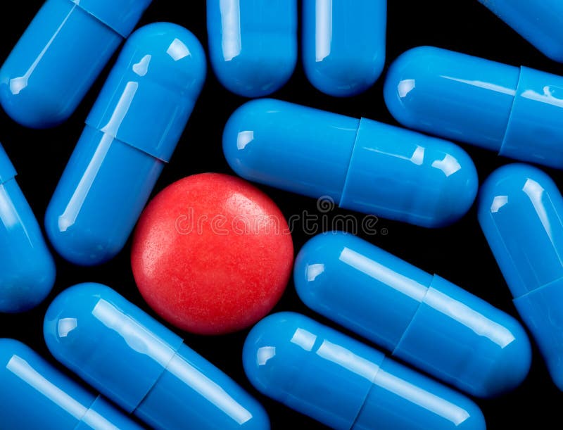 Red Pill between Blue Capsules Stock Image - Image of antibiotic ...