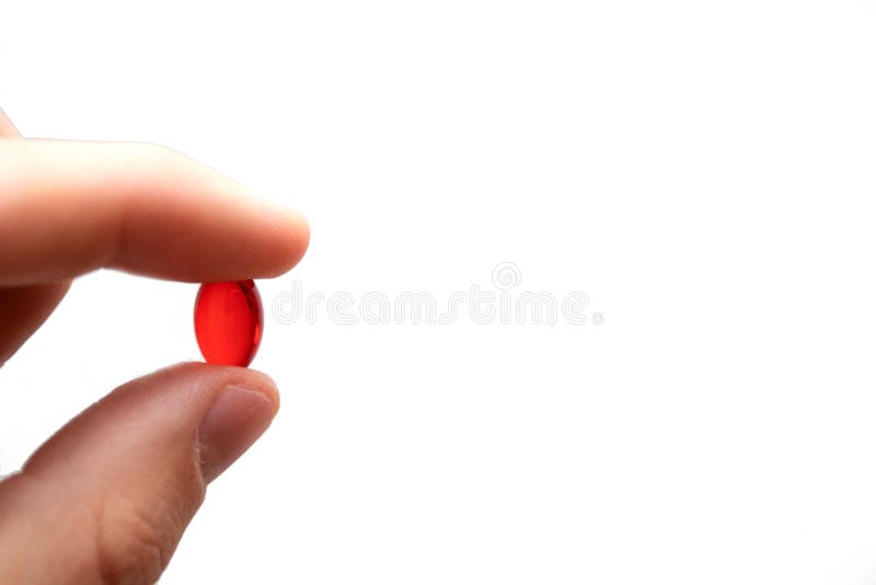 Red Pill Capsule Holding in Hand Stock Image - Image of pill, hand ...