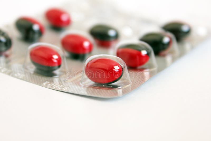 Red shiny gel pills stock image. Image of blue, help, healthcare - 1531059