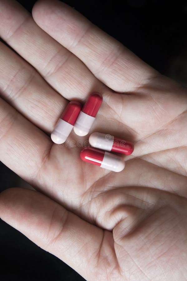 Red and Pink Antibiotic on Man Hand Stock Photo - Image of drugstore ...