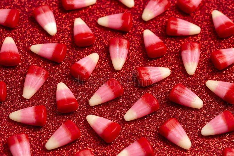 Red Pink and White Valentines Day Candy Corn on a Red Background Stock ...
