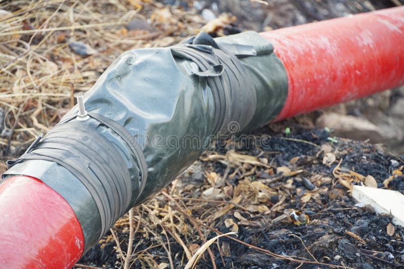 Red pipe on the ground stock image. Image of tube, engineering - 168577225