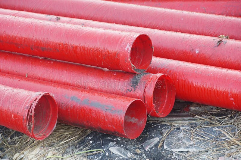 Red pipe on the ground stock image. Image of metallic - 169813555