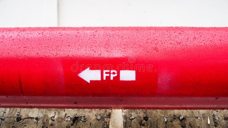 Red pipe with white arrow stock photo. Image of layout - 158121526