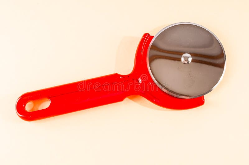 A Red Pizza Cutter with a Silver Handle Stock Photo - Image of retro ...