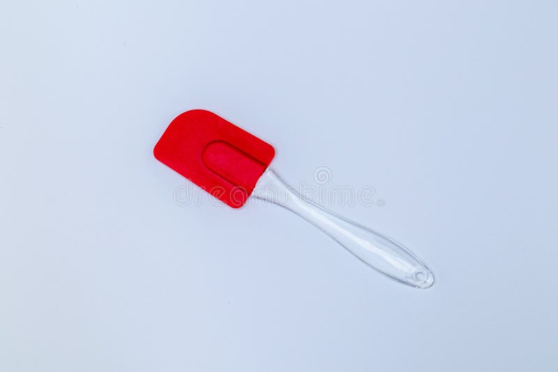 A Red Plastic Spatula Tool Kitchenware on White Background. Stock Photo ...
