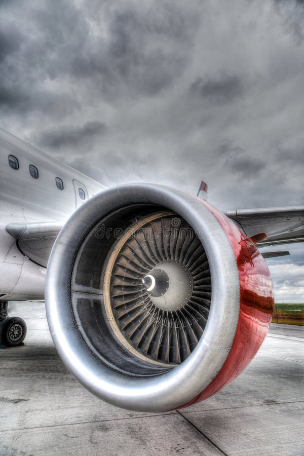 Airplane with Red Engine Flying in Stormy Clouds Stock Image - Image of ...